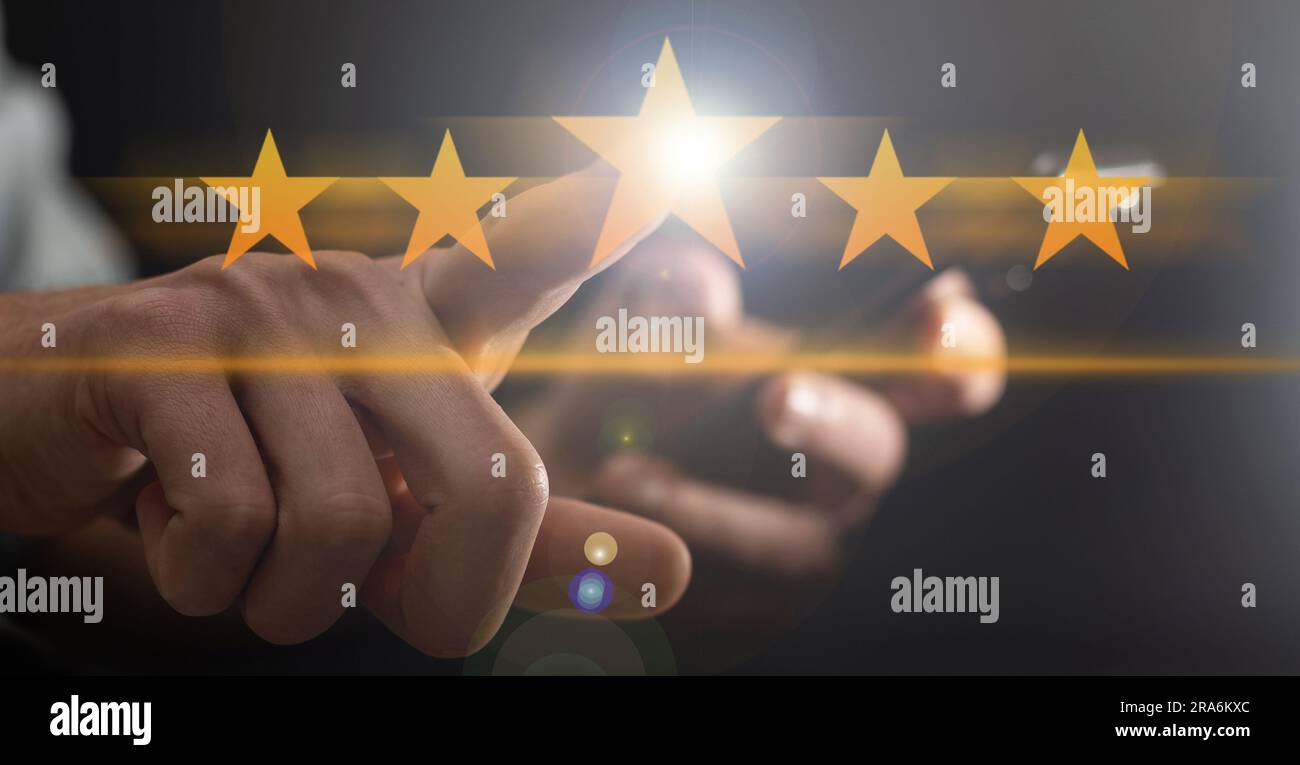 The person's hand pointing at hovering stars. Rating, evaluation Stock ...