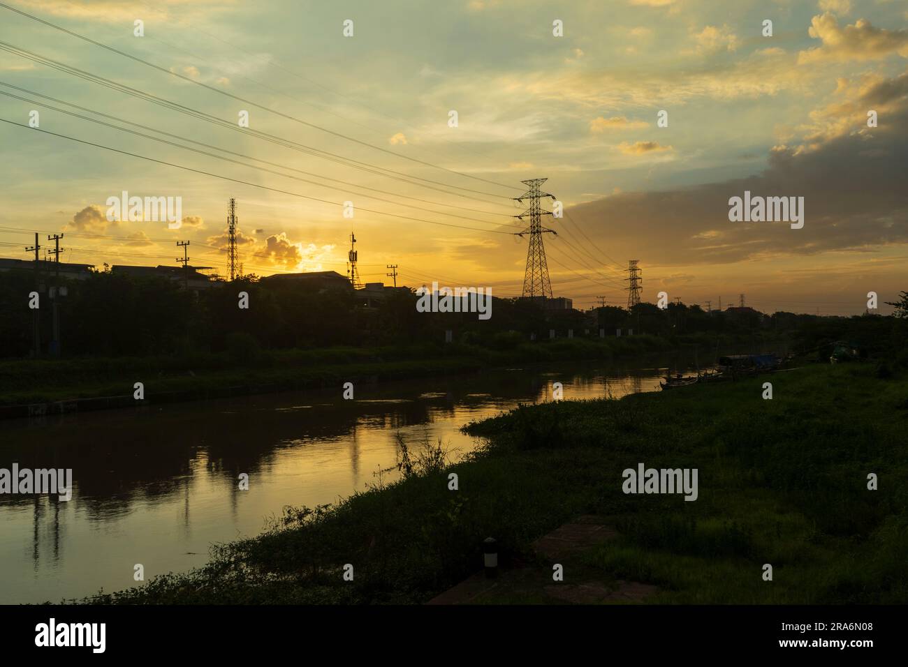 Silhouette and dramatic sunset view of Electricity transmission towers ...