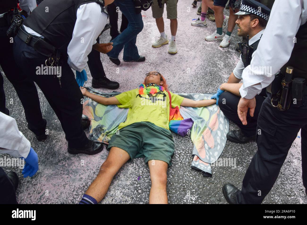 London, UK. 01st July, 2023. Police officers get ready to arrest a ...
