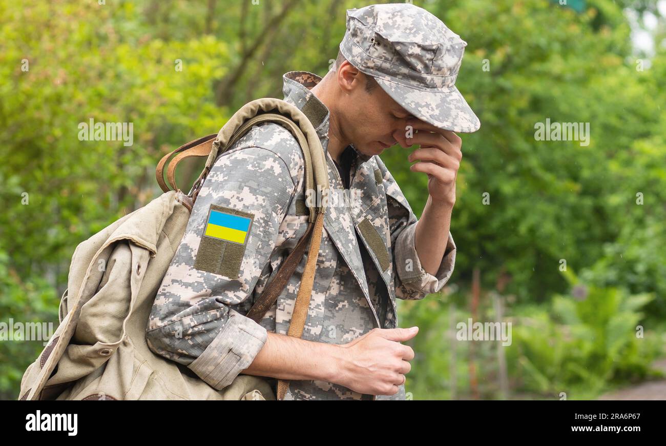 Ukrainian soldier wearing military uniform with flag and chevron ...
