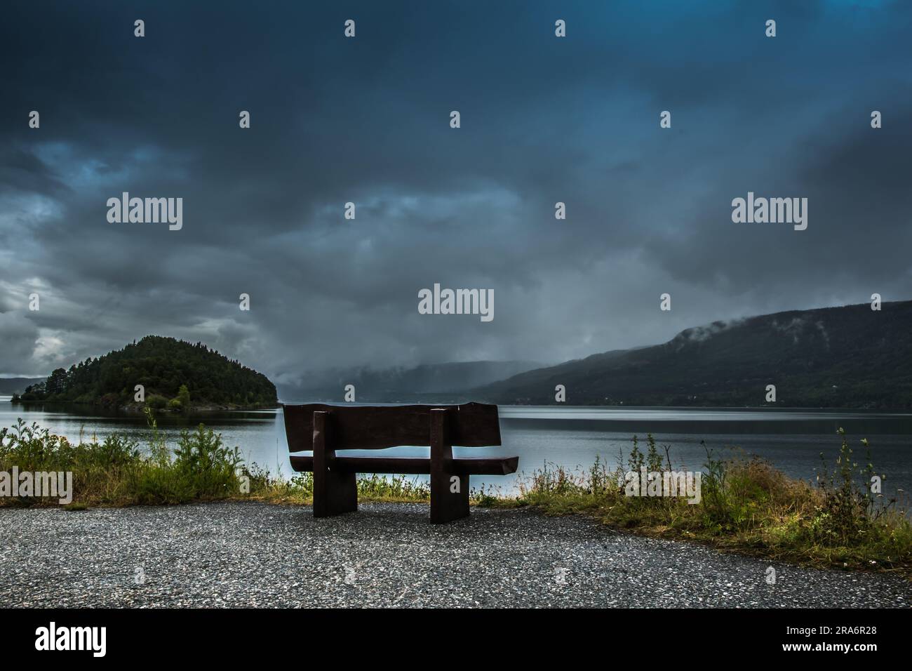 On the shore of lake - comfortable wooden benches. Early morning on the ...