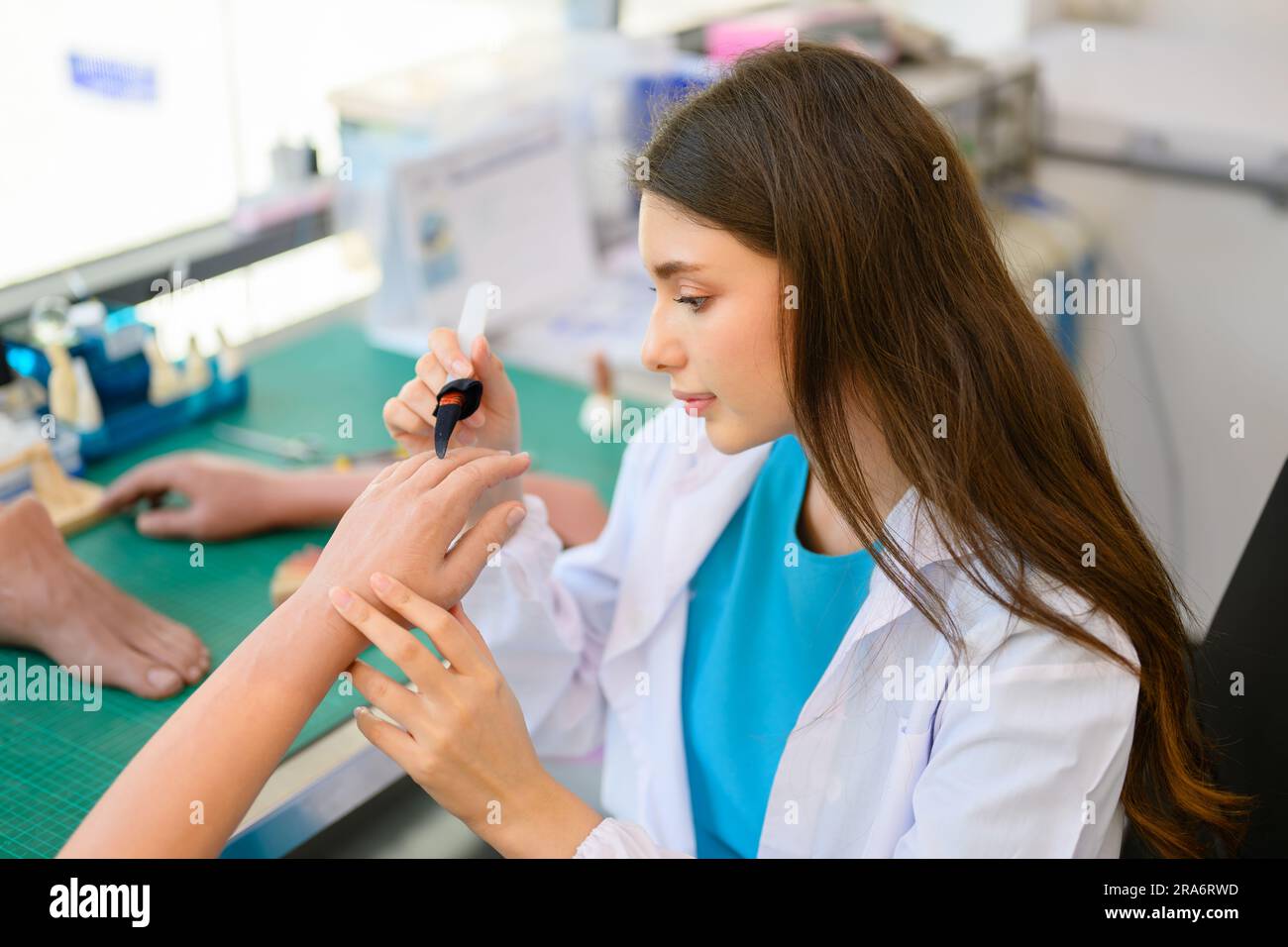 Technician making prosthetic limb device at laboratory Stock Photo - Alamy