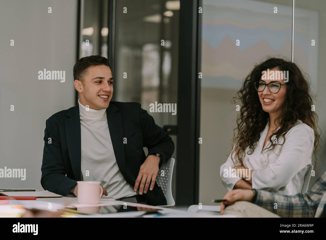 Young people enjoying while team working at the office. They are ...