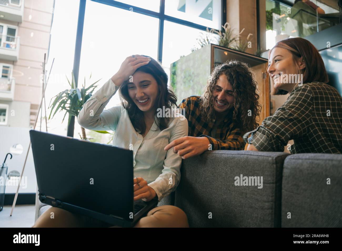 Brunette girl holding her forehead wondering how simple and stupid ...