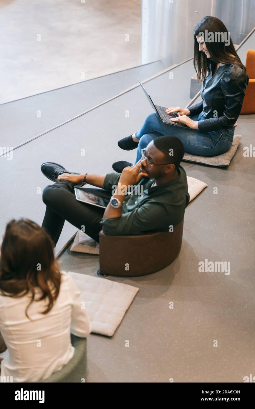 Multiracial employees working together. Diverse businesspeople having a ...