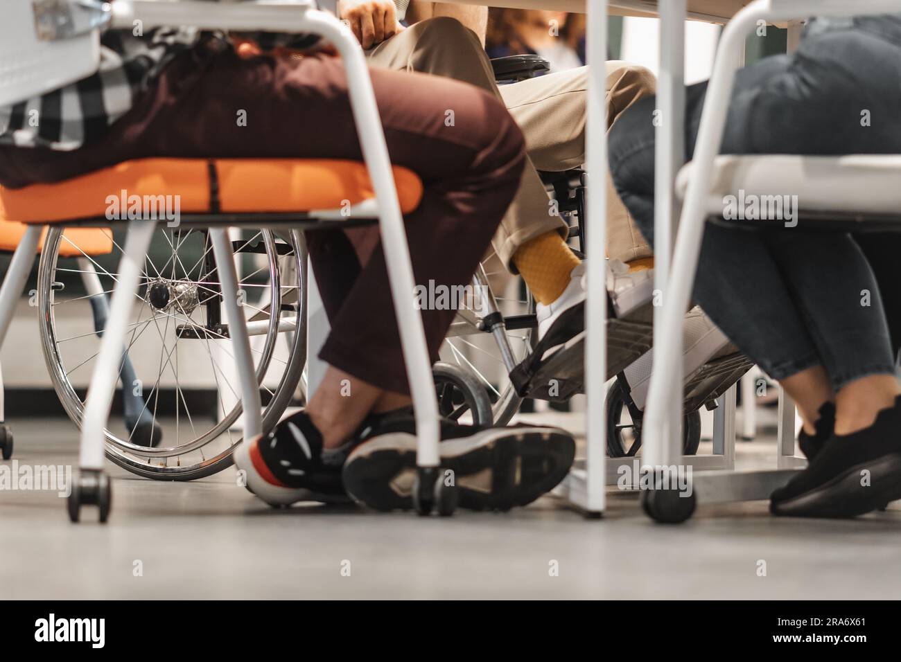 Cropped photo of handicapped male employee in wheelchair. Disability ...