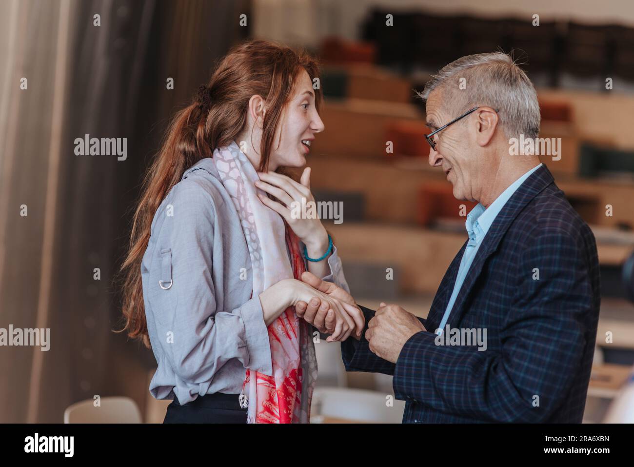 Senior businessman greeting his employee, mature businessman shaking ...