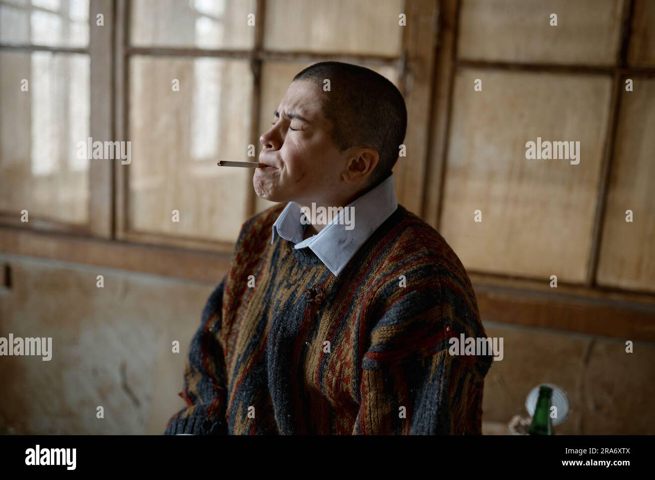 Portrait of young frustrated homeless woman smoking cigarette Stock ...