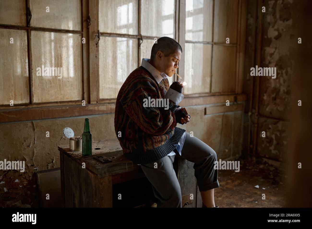 Portrait of young frustrated homeless woman smoking cigarette Stock ...