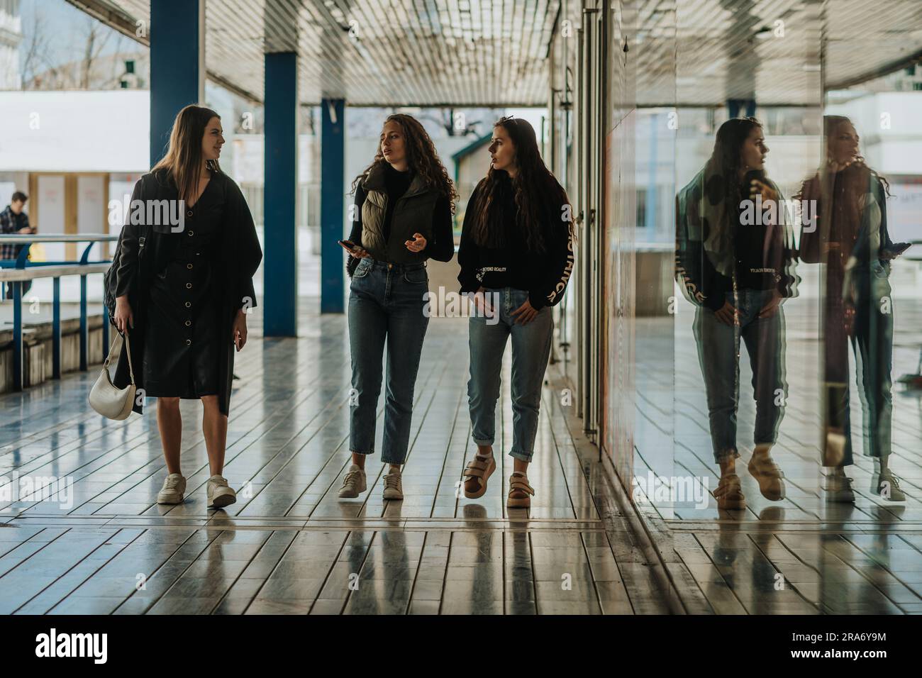 Two lovely girls asking their female friend (left) why she crossed ...