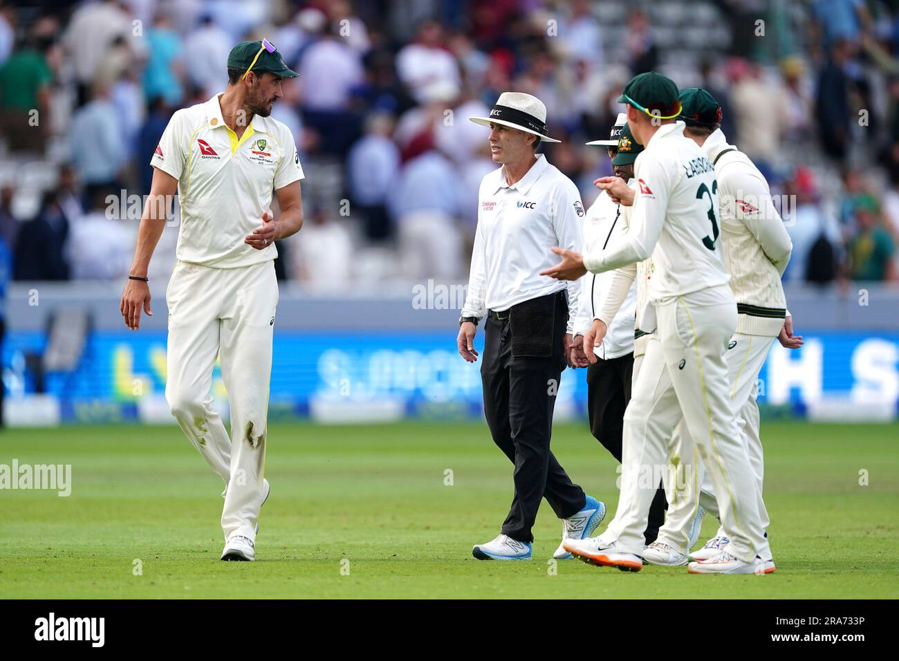 Australia players surround the umpires following the conclusion of day ...