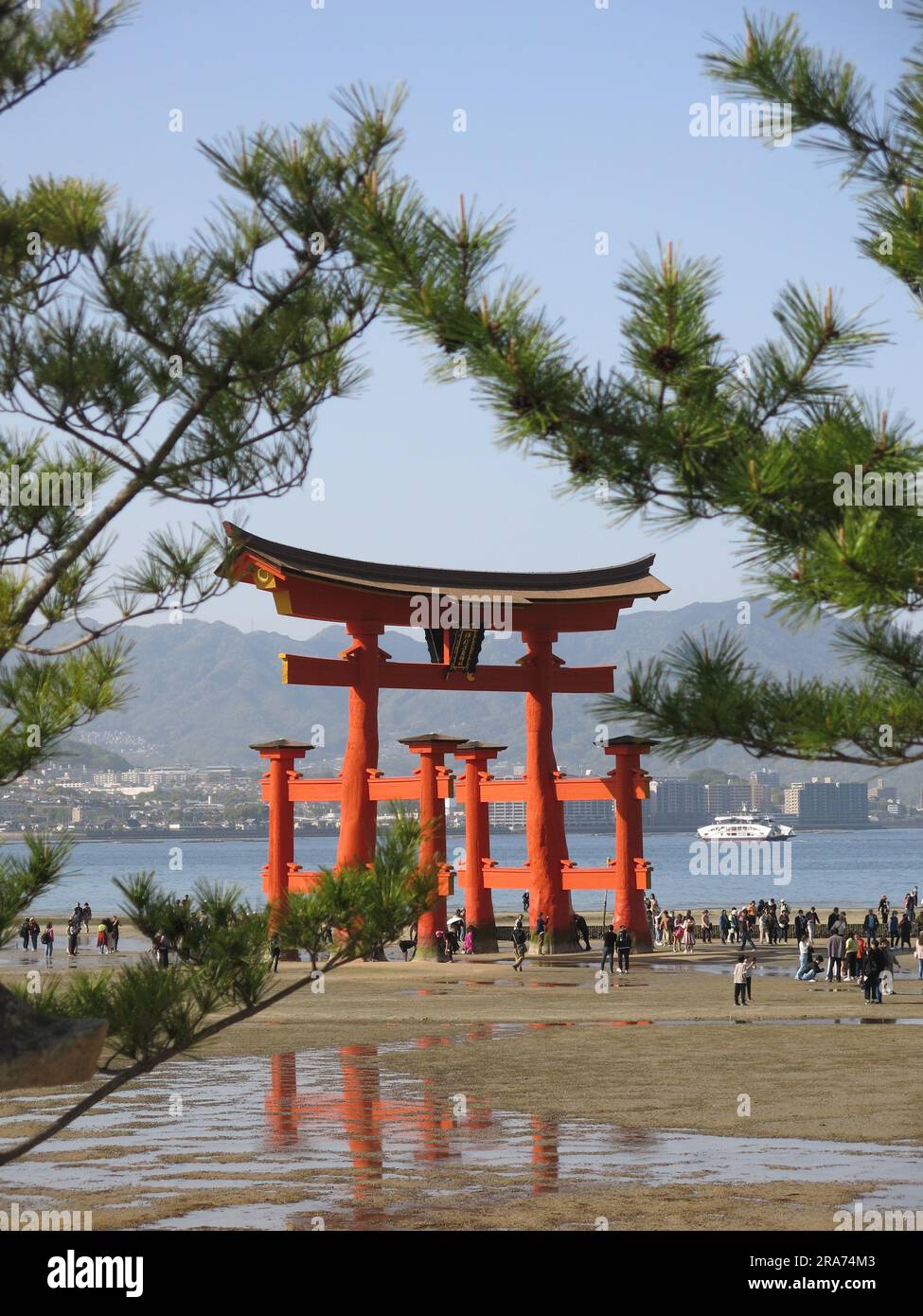 The 16.6m tall red Torii Gate on the beach at Miyajima Island dominates ...