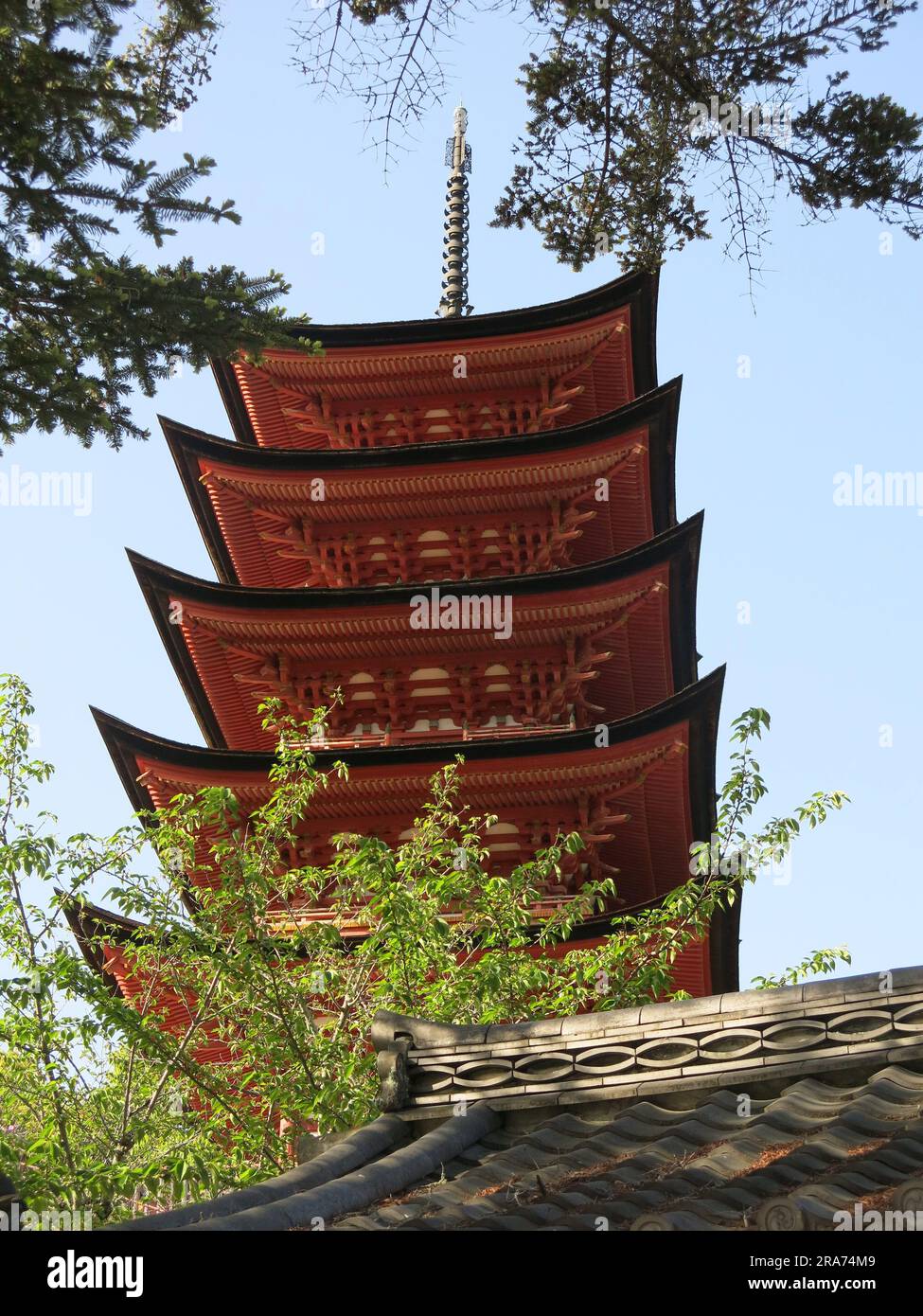 Bright red, five-storied pagoda, one of the buildings that makes up the ...