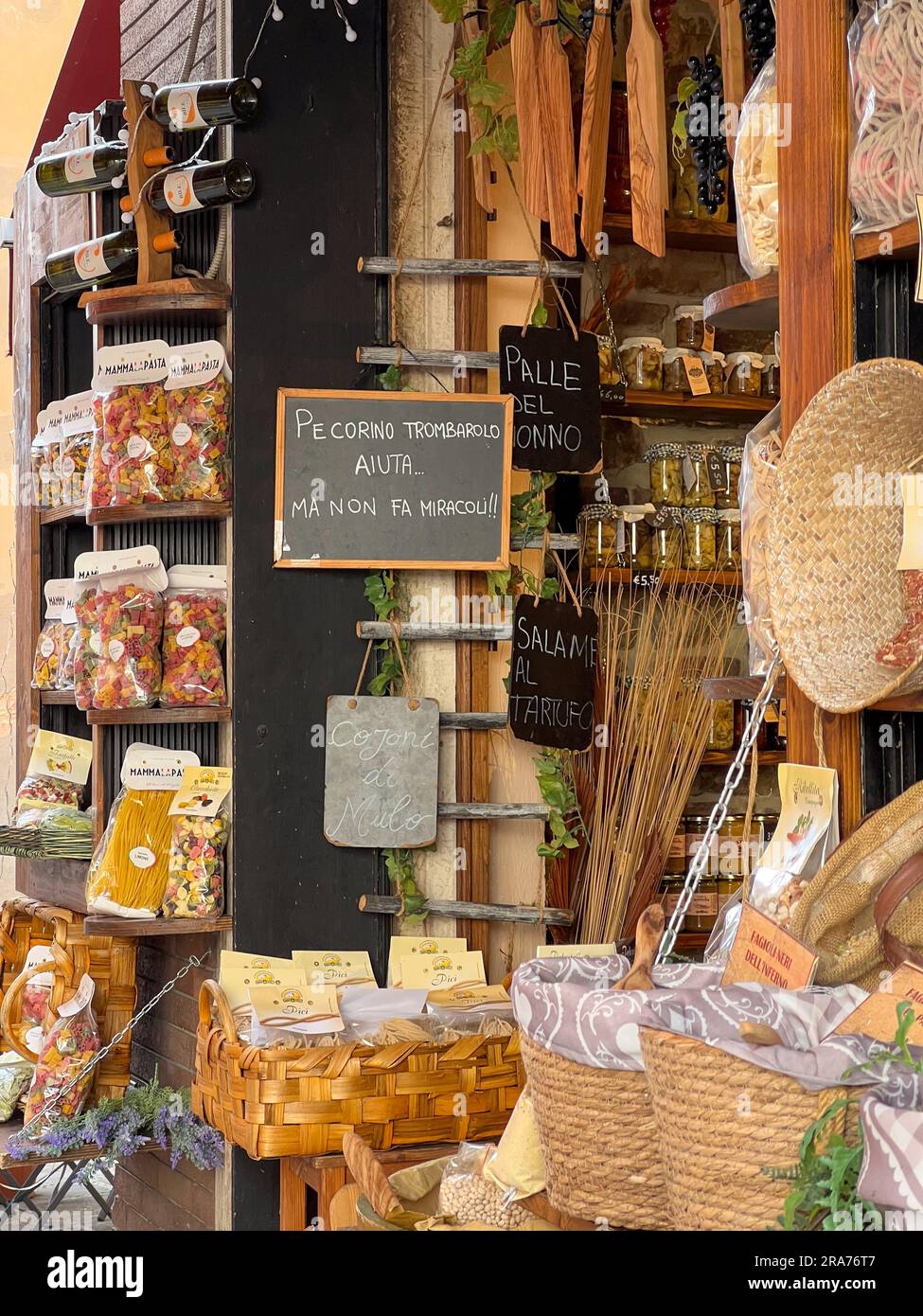 Italian food specialties at a shop entrance in Castiglione del Lago ...