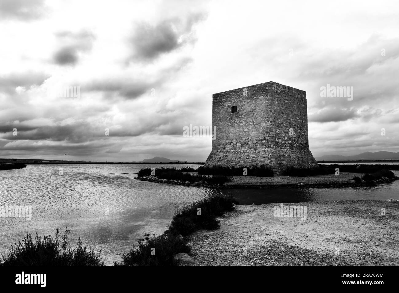 Beautiful Tamarit tower surrounded by salt lagoons in Santa Pola ...