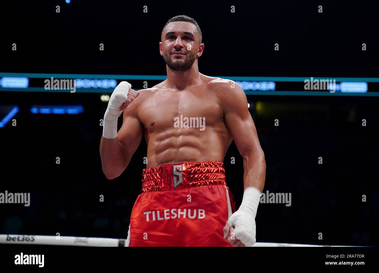 England's Callum Simpson is declared the winner following his super ...