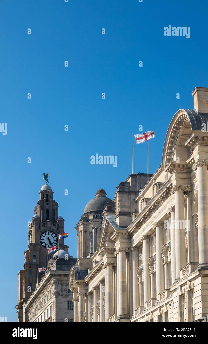 The Three Graces with English flag flying in Liverpool Stock Photo - Alamy