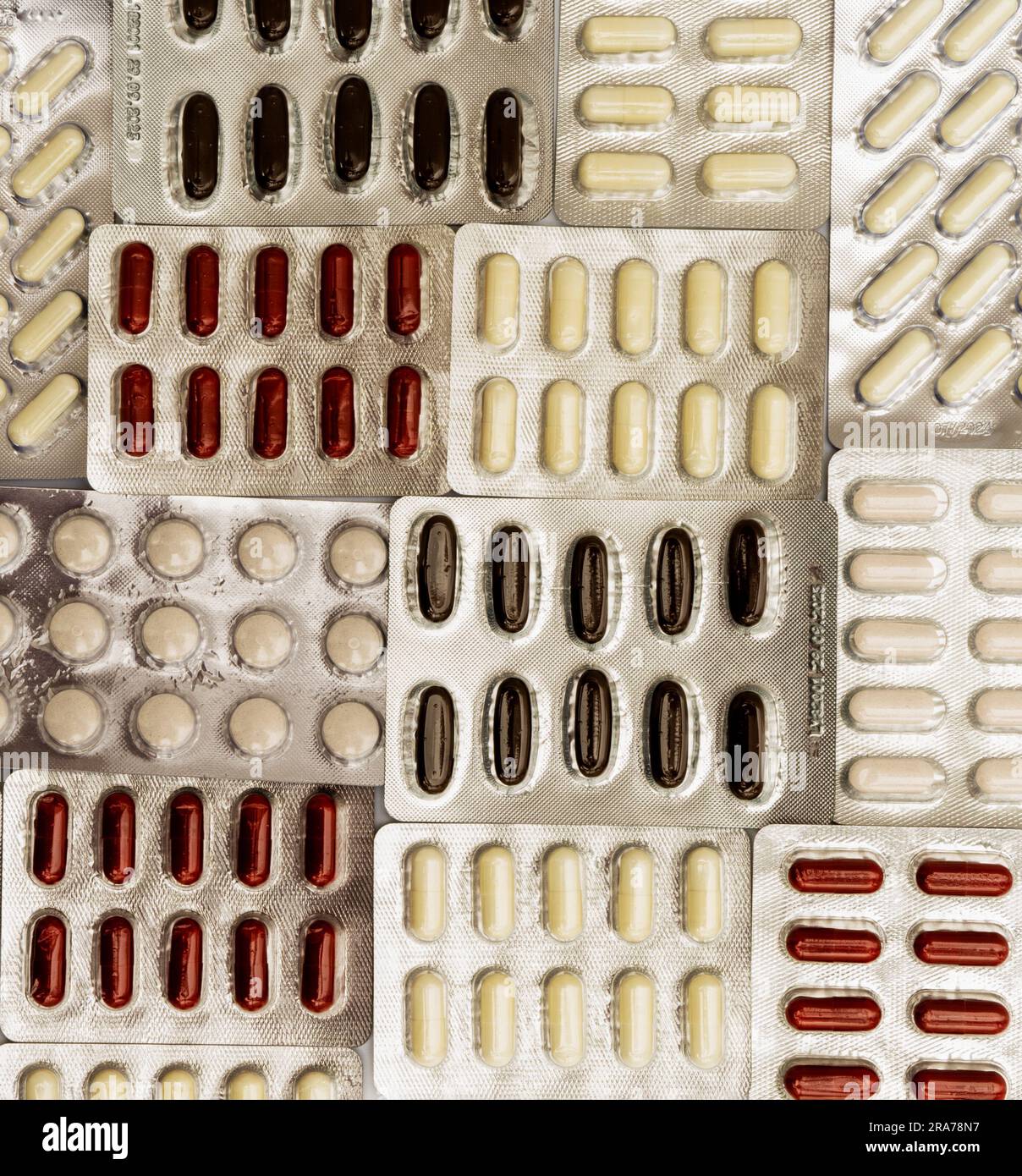 Abstract texture of blisters of multicolored round pills. Various ...