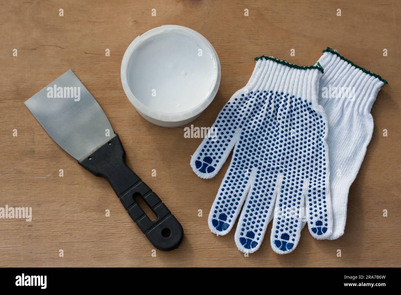 Builders kit, construction spatula, can of white putty, protective ...