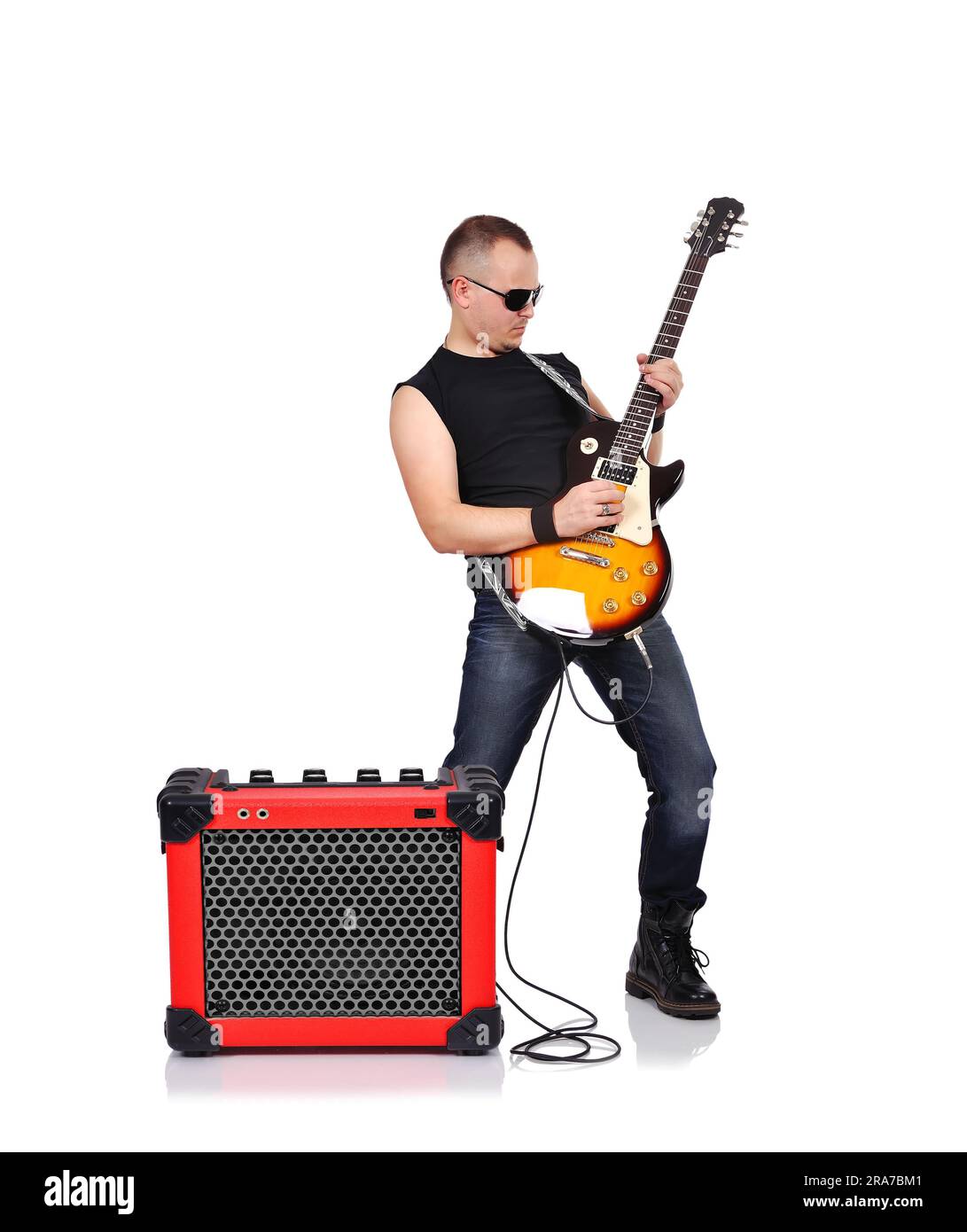 rocker playing on electrical guitar and guitar combo Stock Photo - Alamy