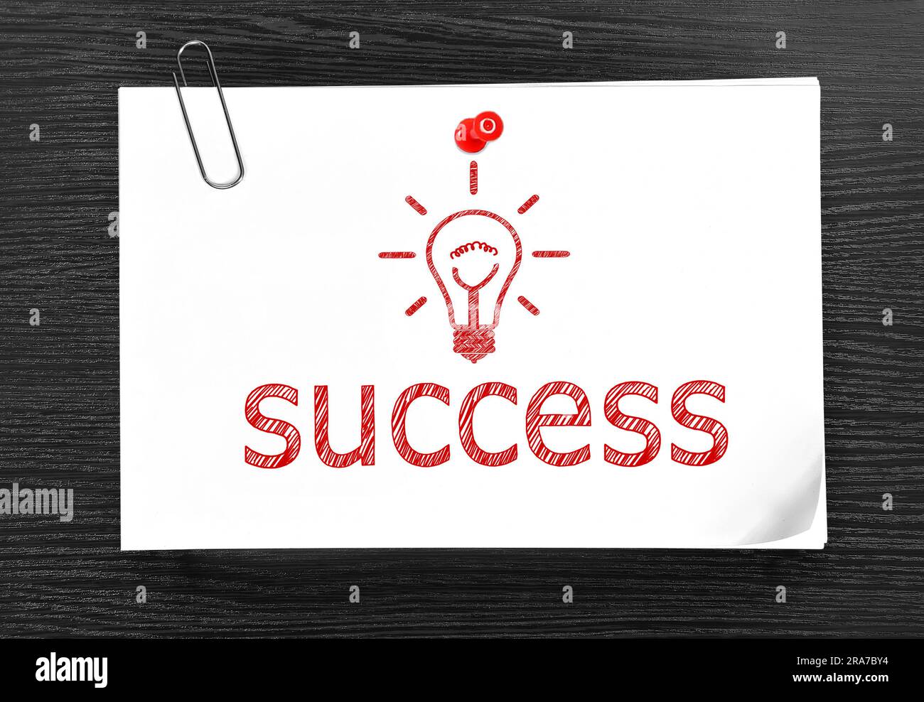 paper with drawing success attached to wooden wall Stock Photo - Alamy