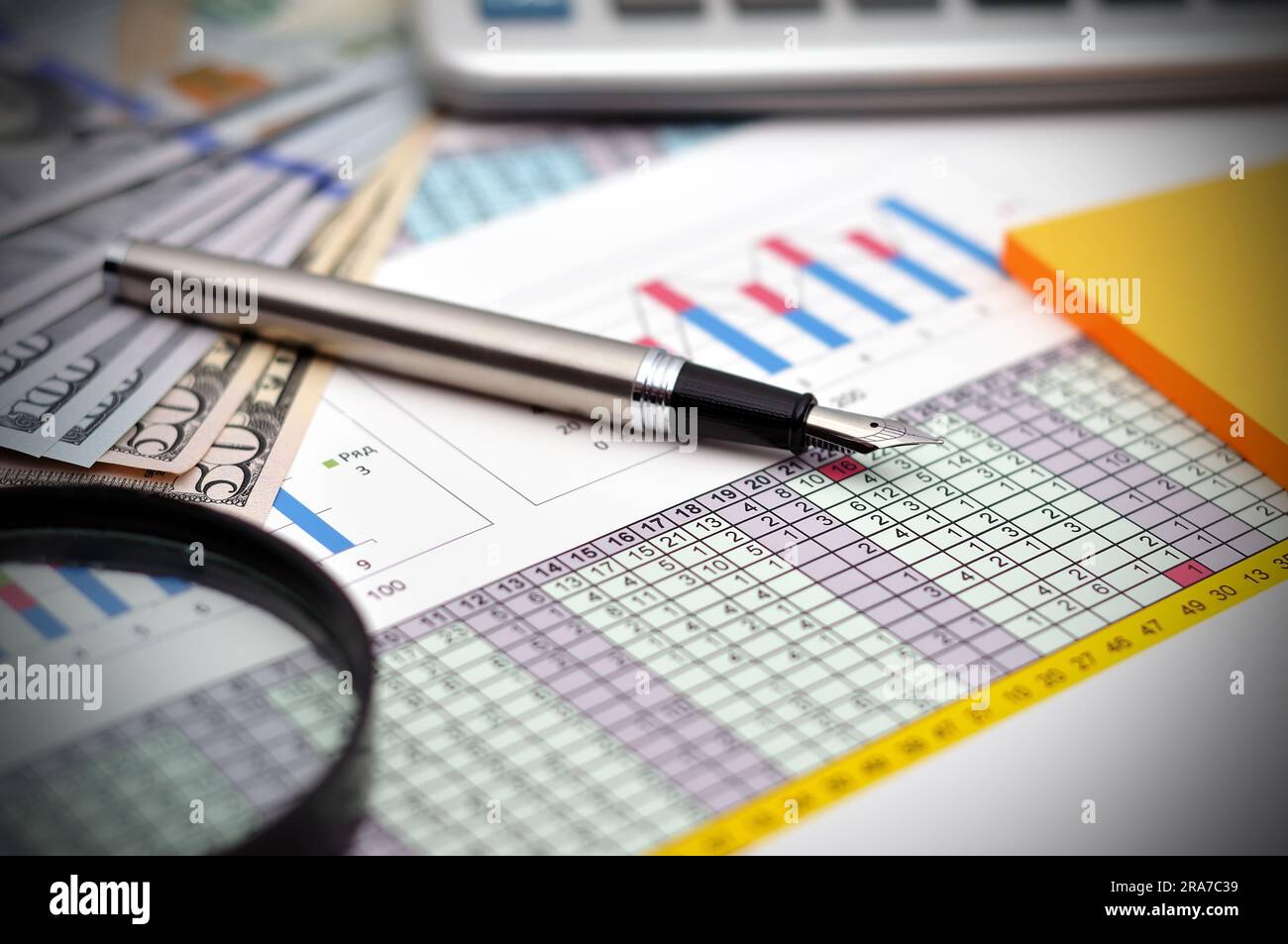 money, fountain pen and financial chart on table Stock Photo - Alamy