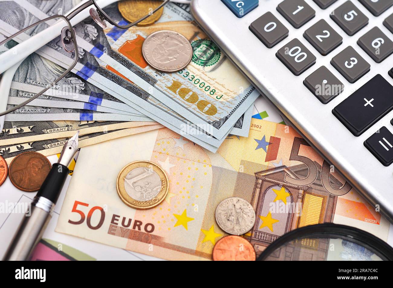 financial table with calculator, pen and euro Stock Photo - Alamy