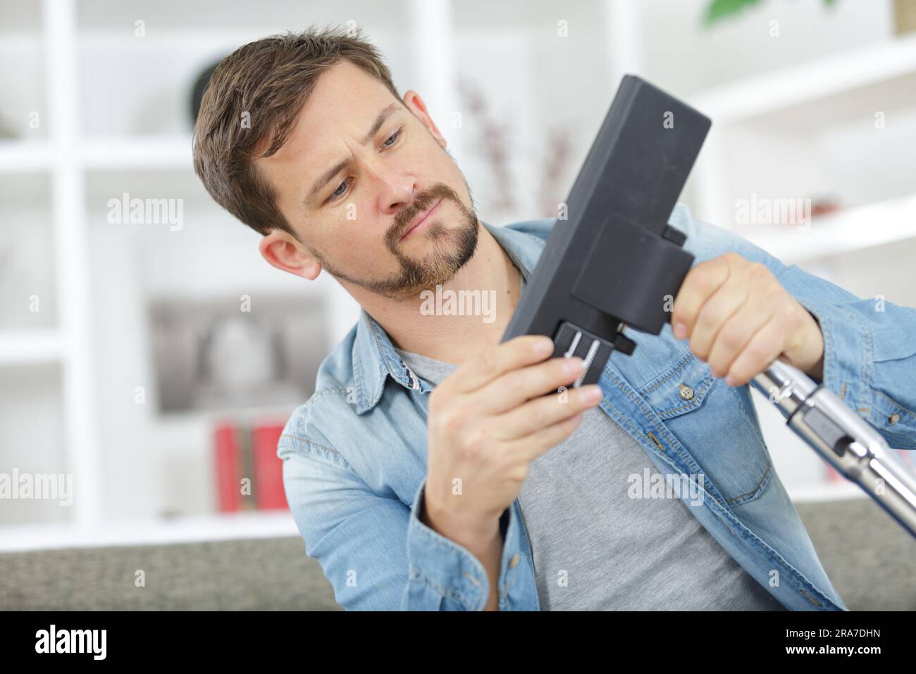 Man hoovering room hi-res stock photography and images - Alamy