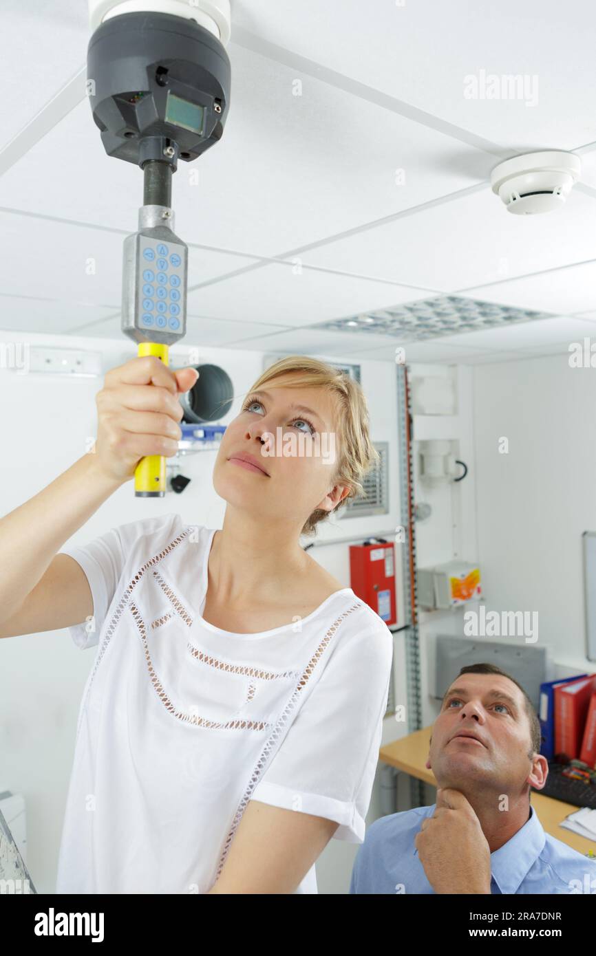 manual worker checking air in an office Stock Photo - Alamy