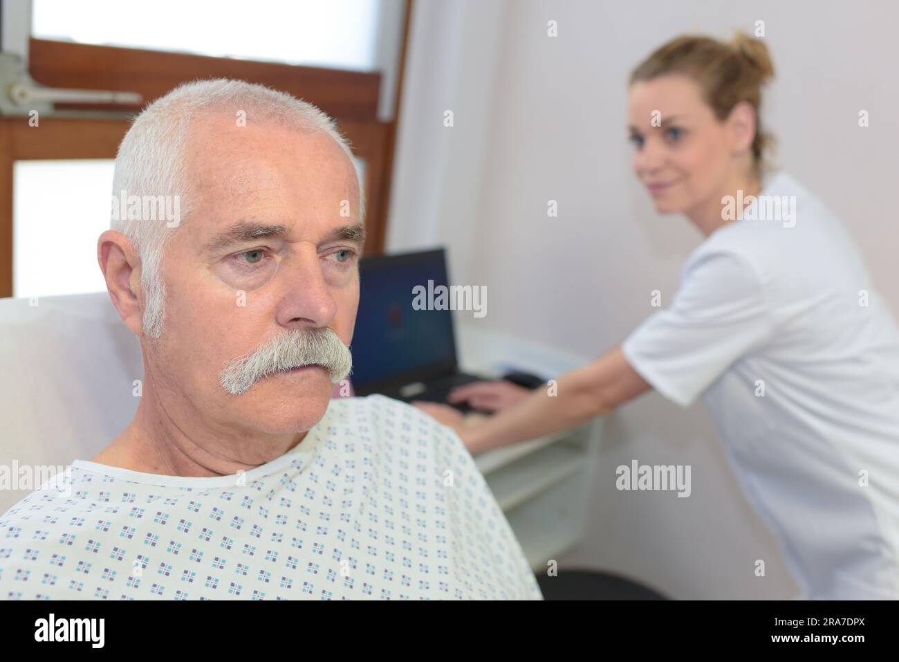 young female doctor talking with patient Stock Photo - Alamy