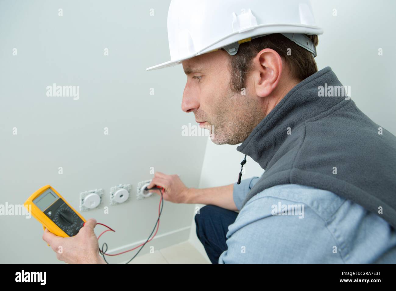 electrician measuring voltage of socket Stock Photo - Alamy