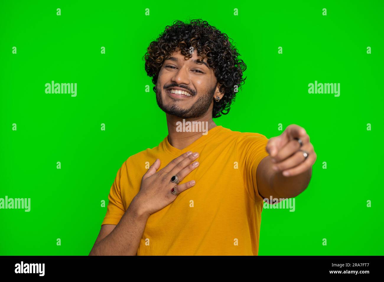Amused bearded indian man pointing finger to camera, laughing out loud ...