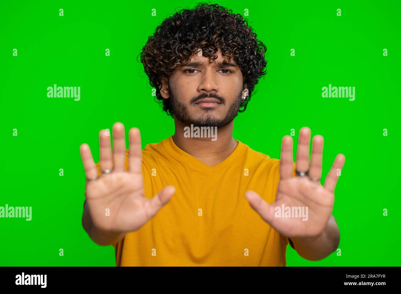 Indian man say No hold palm folded crossed hands in stop gesture ...