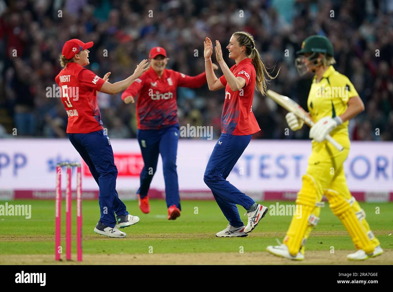 England's Lauren Bell (centre right) celebrates taking the wicket of ...