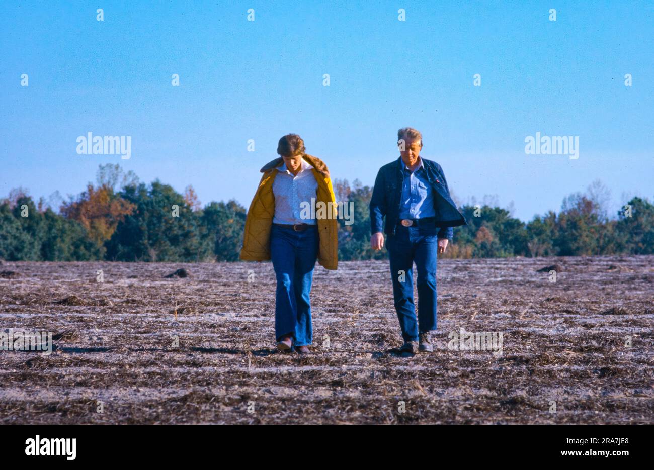 President Jimmy Carter and his son, Chip Carter, walk the dormant ...