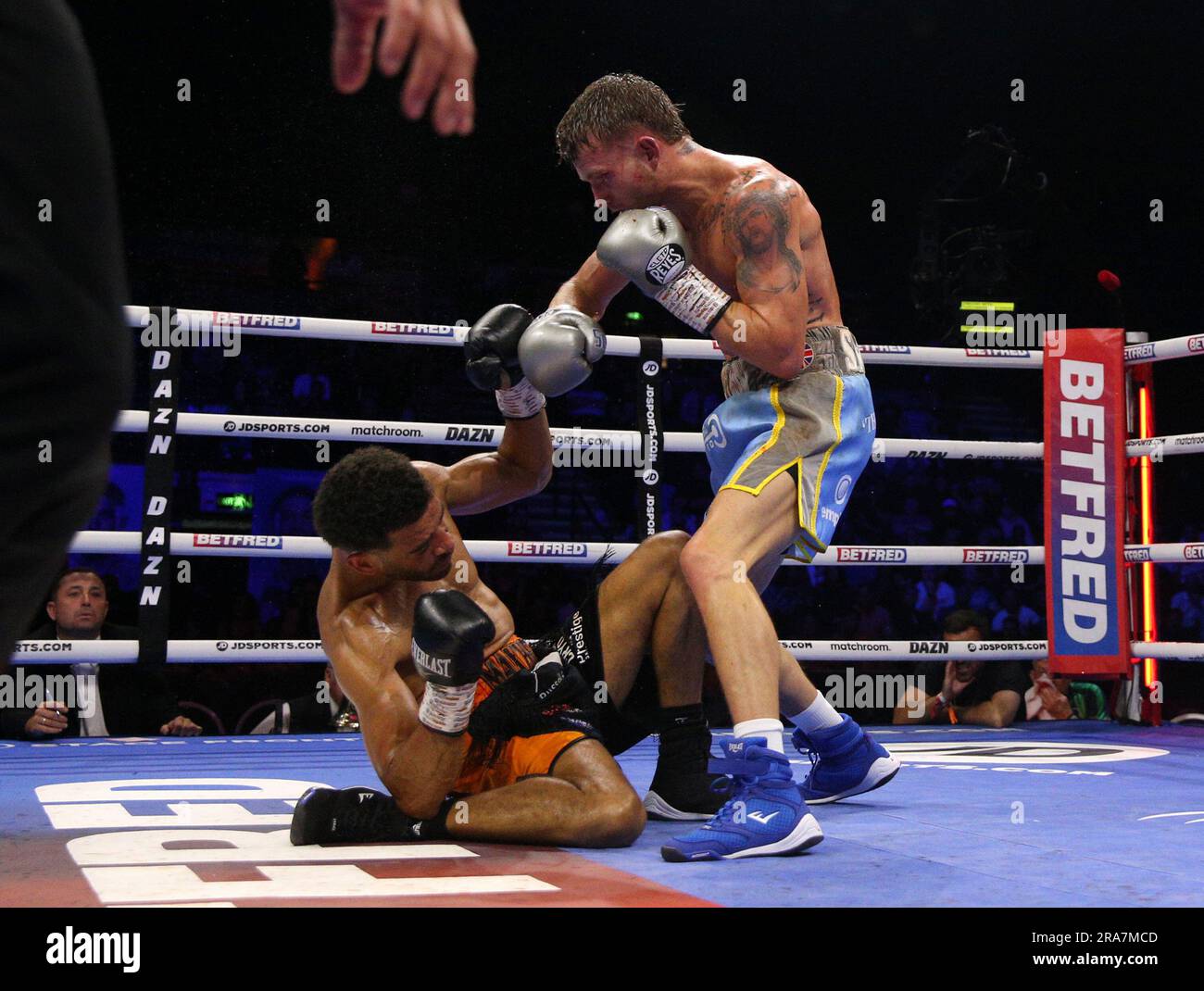 Sam Maxwell (left) is knocked out by Dalton Smith during their British ...