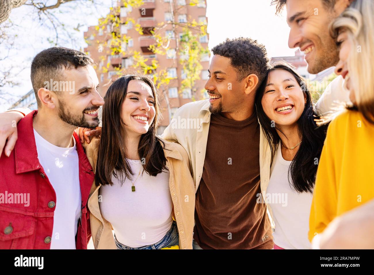 Young students group smile standing together outdoors Stock Photo - Alamy