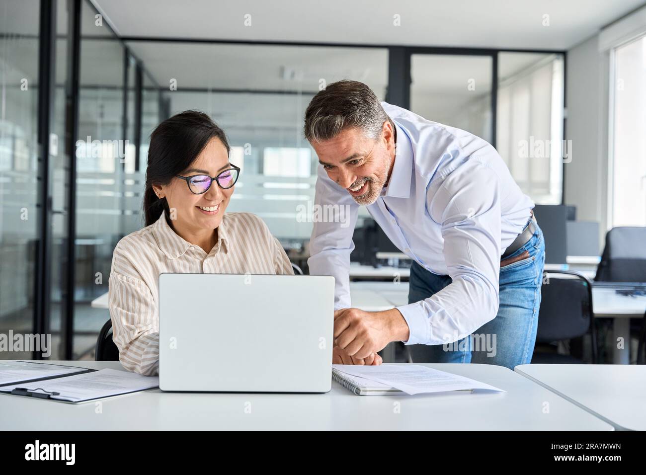 Female office worker helping male hi-res stock photography and images ...