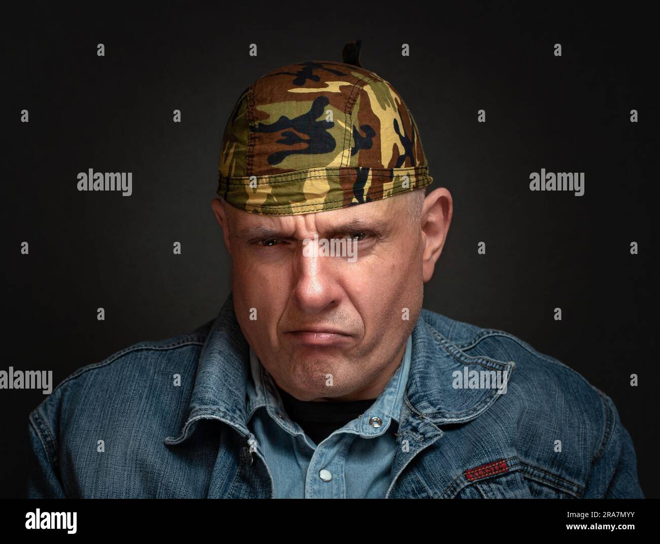 Mature man looking into camera close up headshot portrait Stock Photo ...