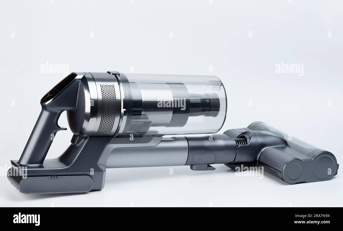 One small gray vacuum cleaner side view isolated on studio background ...