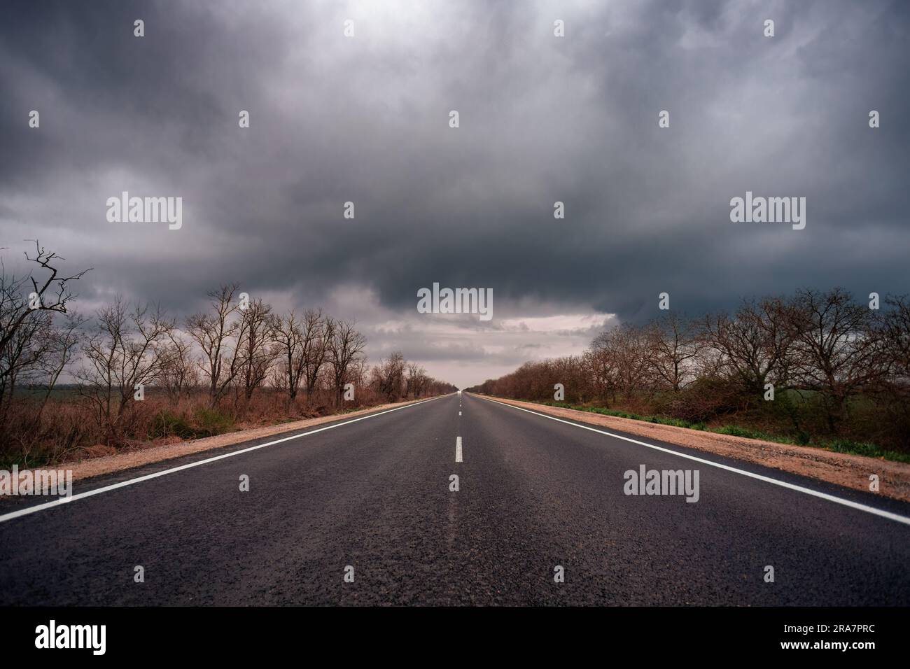 Straight road under storm clouds hi-res stock photography and images ...