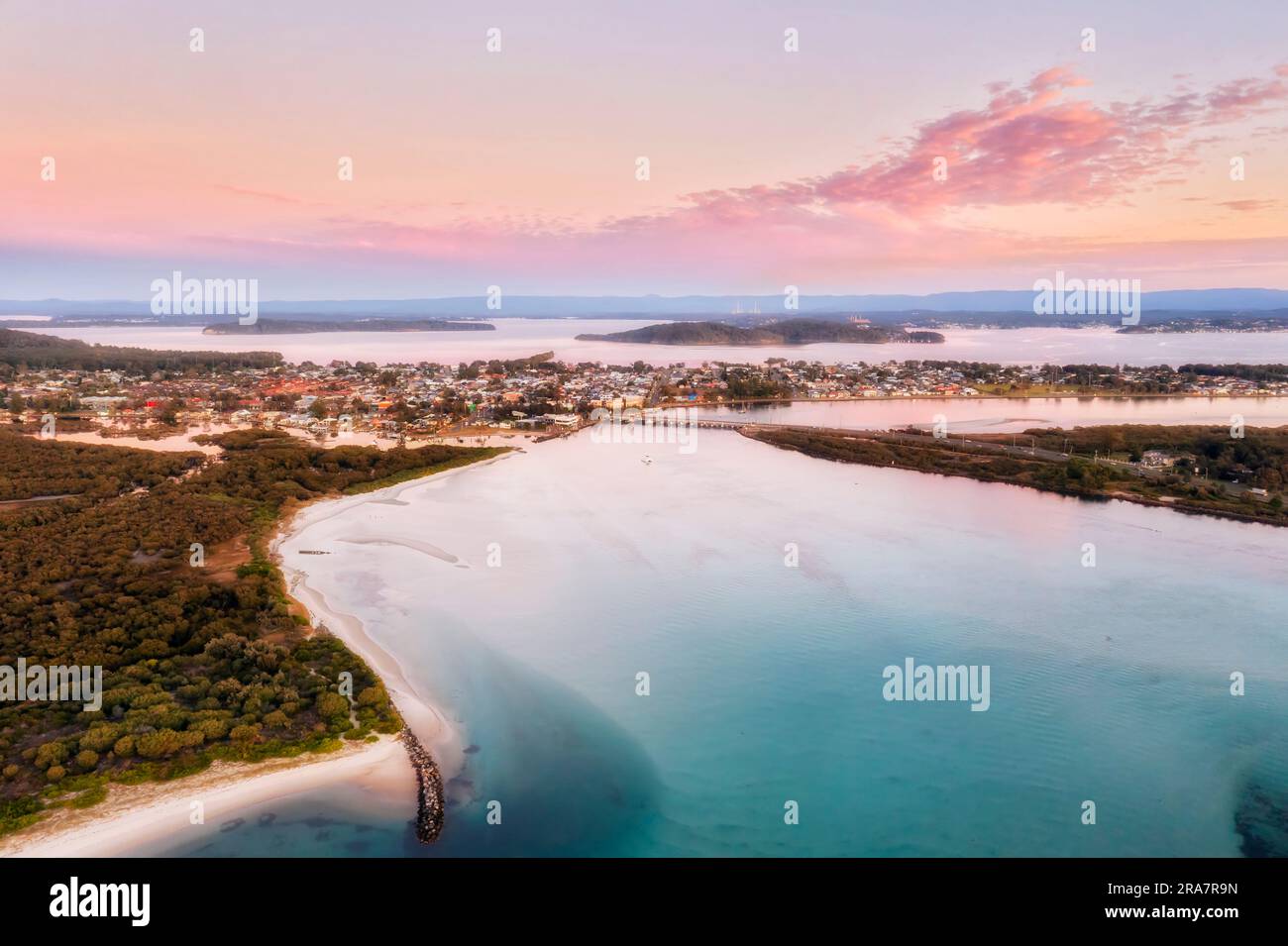 Scenic aerial sunrise lakescape over Swansea channel bridge and town on ...