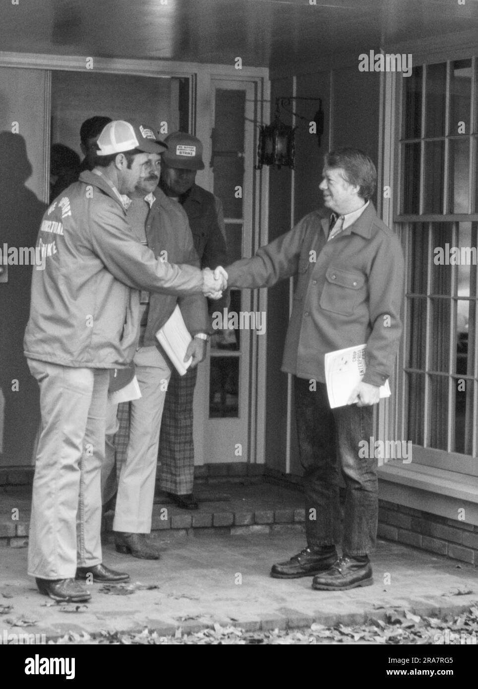 President Jimmy Carter, standing at the front door of his Plains, GA ...