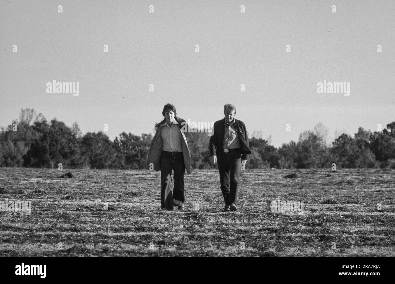 President Jimmy Carter and his son, Chip Carter, walk the dormant ...