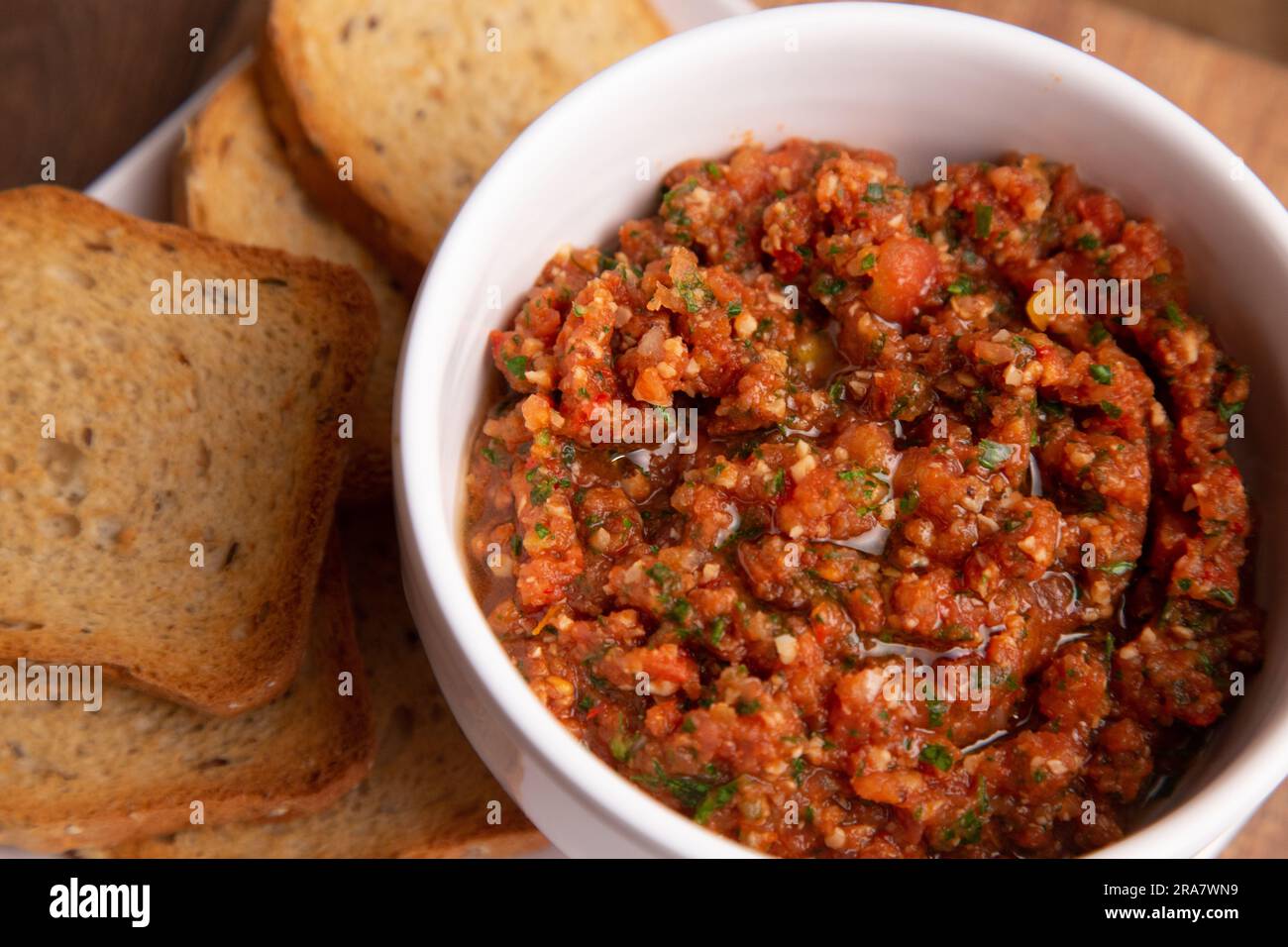 Traditional Turkish appetizer "Ezme" made with fresh tomatoes and ...