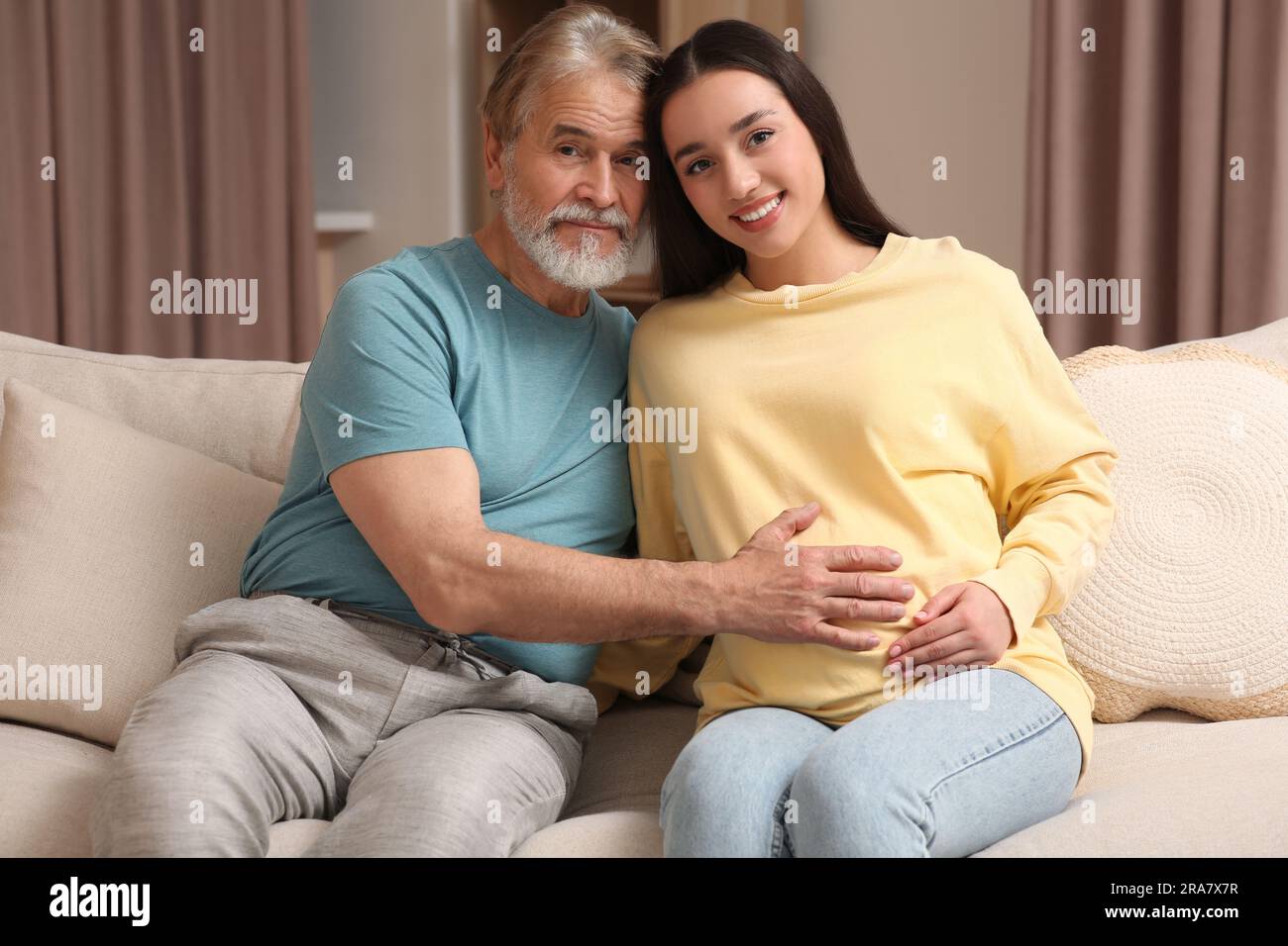 Father And His Pregnant Daughter Indoors Grandparents Reaction To