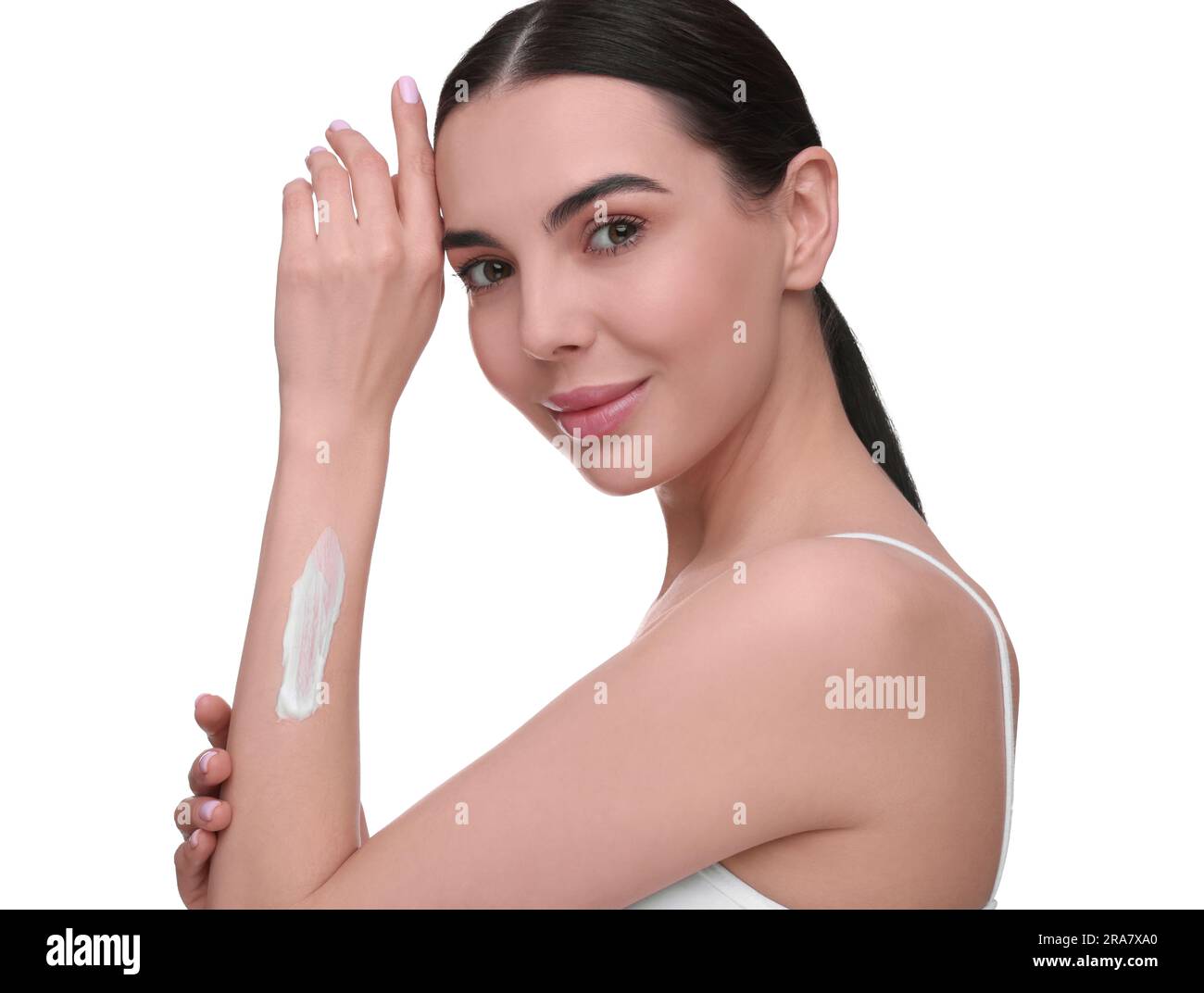 Beautiful woman with smear of body cream on her arm against white ...