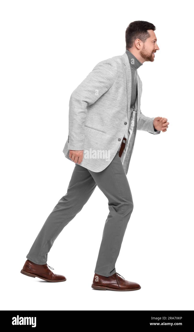 Handsome bearded businessman walking on white background Stock Photo ...