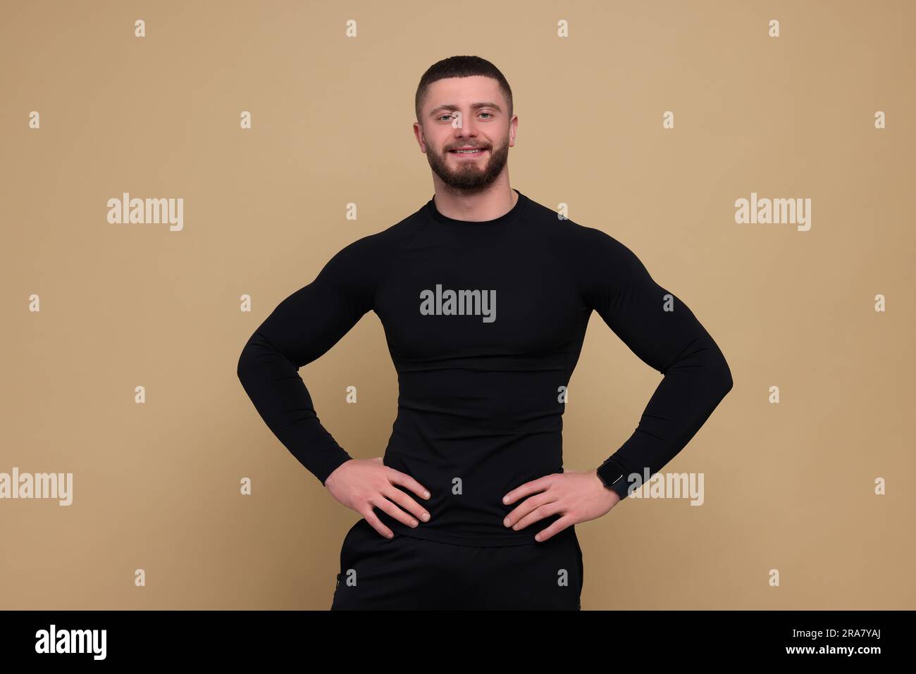 Portrait of handsome sportsman on brown background Stock Photo - Alamy