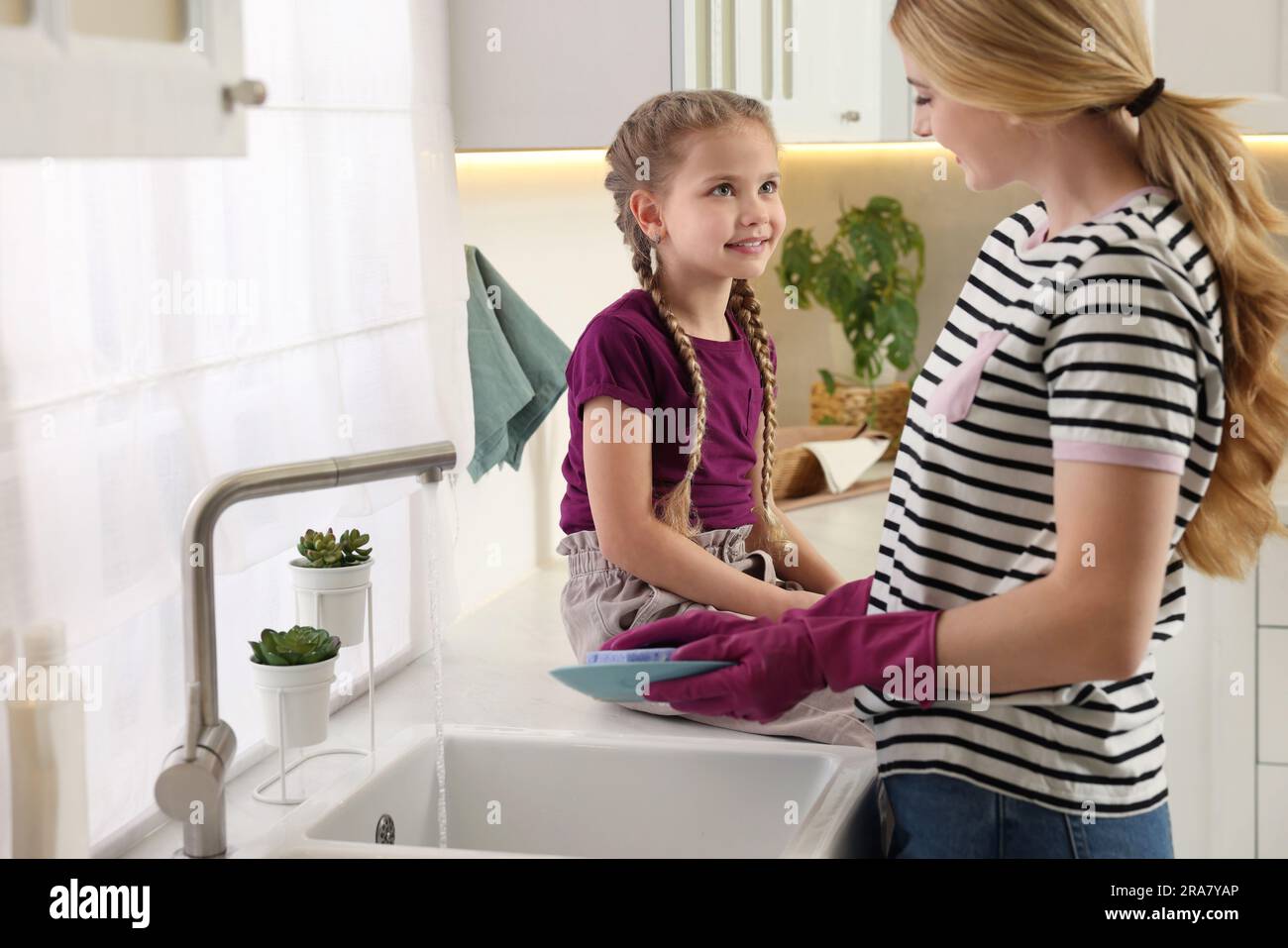 Daughter pouring water hi-res stock photography and images - Alamy